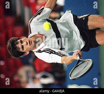 Tim Henman starts the defence of his National Tennis title with a two ...