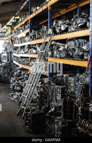 Garage raid in London. Engine parts are seen as police officers raid ...