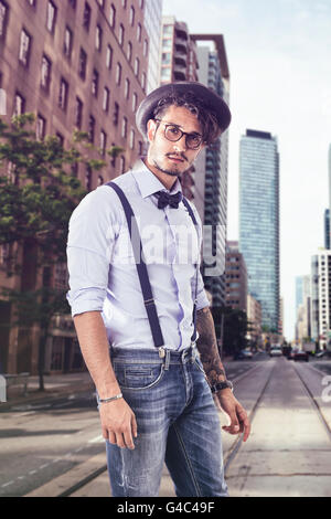 Handsome hipster looking at camera Stock Photo - Alamy
