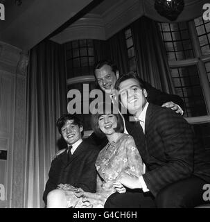 BRIAN EPSTEIN at right with Billy J. Kramer and Cilla Black, talks to ...