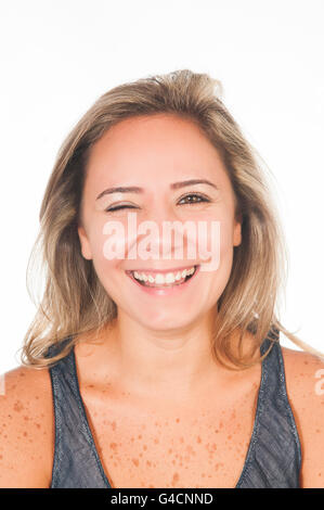 Happy blond girl winking and smiling, showing thumbs up, like and ...