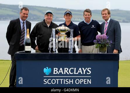England's Luke Donald celebrates with the trophy after winning the ...