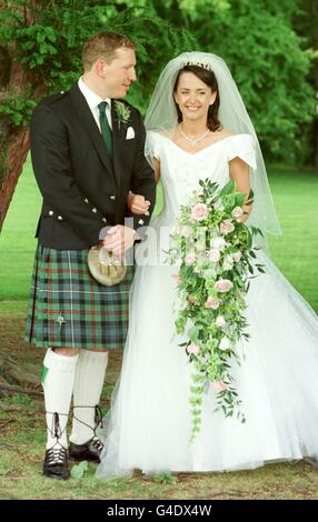 Scots rugby international Andy Nicol kisses his new wife Janet McGregor following today's ...