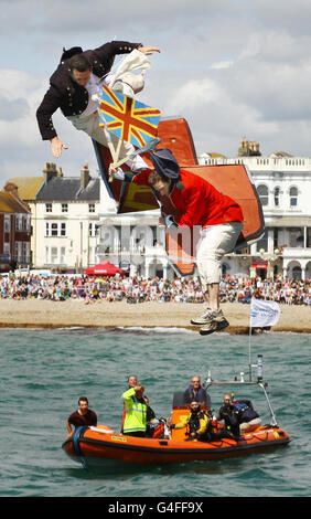 Richard and Michael Folsom leap off Worthing Pier in Worthing, East ...