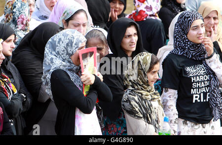 Mourners attend the funeral of Shazad Ali, Abdul Musavir and their ...