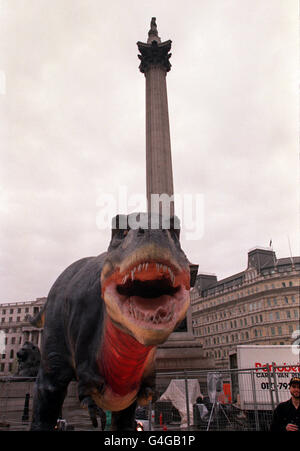 A life-size model of a T-Rex prowls through Trafalgar Square, London ...
