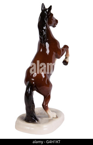 A chess horse and a toy horse on a white background Stock Photo - Alamy