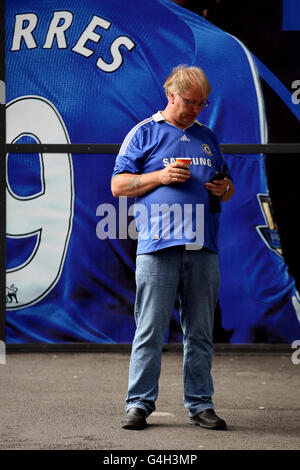 Chelsea fans arrive before the Premier League match at Stamford Bridge ...