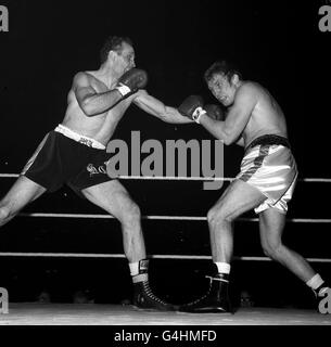 London heavyweight Billy Walker, left, fends off a left from ...