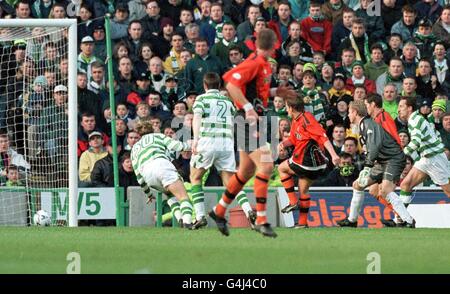 Dundee United's Billy Dodds (right) celebrates his first goal with his ...