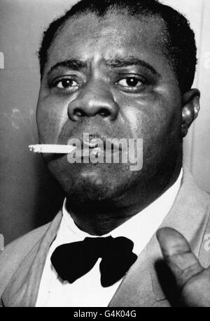 Louis Armstrong - portrait of the American jazz musician holding a ...