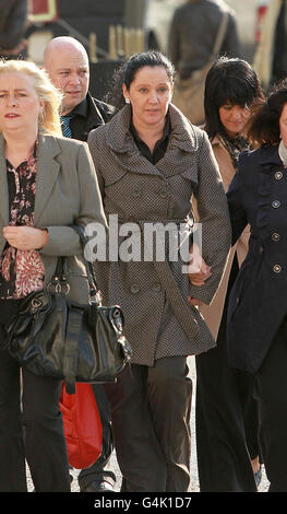 Aine Tyrell (centre), daughter of Liam Adams, arrives at court in ...