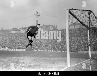 Bishop Auckland goalkeeper Harry Sharratt makes a save during the match ...