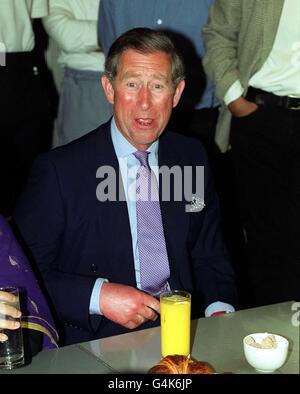 The Prince of Wales laughs after (left to right) Julie Rogers, and ...