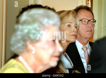 Australian actor Geoffrey Rush (centre) arrives at the Federal Court in ...