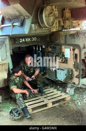Sgt. Trevor Childerley from Nottingham loads a shell in to an SA90 on ...