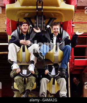 911 band members Jimmy Constable (L) and Simon 'Spike' Dawbarn try the ...
