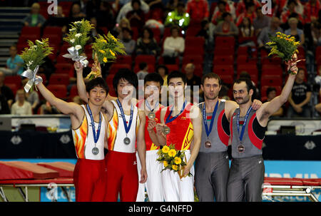 China's team celebrate their silver medals after Team Free Routine ...