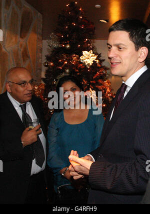 South Shields MP David Miliband, (centre), is seen with Aran Handa ...