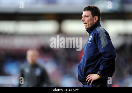 Coventry City assistant physiotherapist Sam Heathcote (left) oversees ...