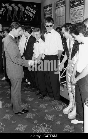 Prince Charles shaking hands with Madness guitarist Chris 'Chrissy Boy ...