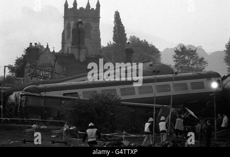Train carriages and debris lie strewn across the tracks following an ...