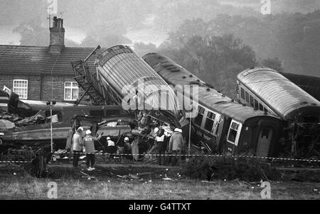 Train carriages and debris lie strewn across the tracks following an ...