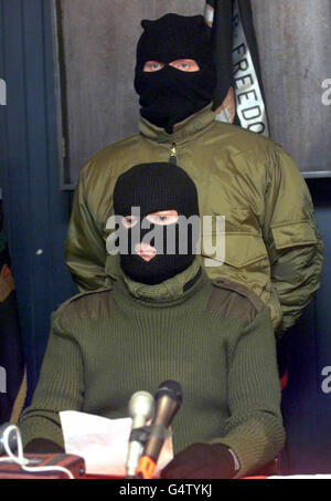 A masked member of the Ulster Freedom Fighters (UFF), displays a ...