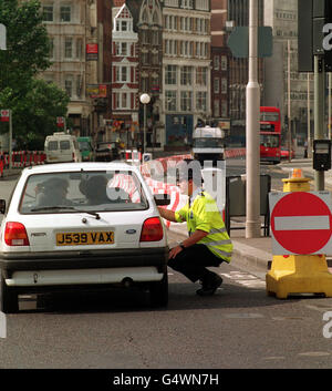 Police checking vehicles at anti-terrorist roadblocks set up in the ...