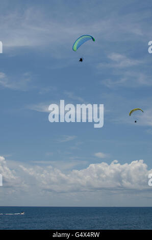 Paragliding against the blue sky Stock Photo - Alamy