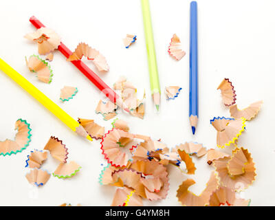 Colorful pencil shavings on a brown background Stock Photo - Alamy