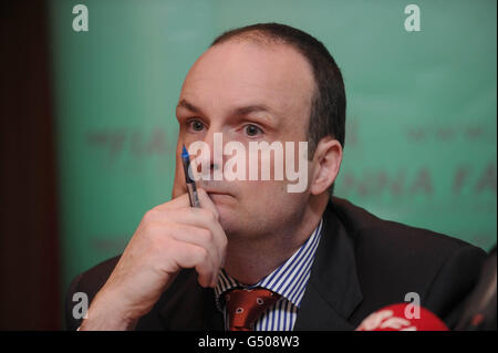 Fianna Fail General Secretary Sean Dorgan listens as leader Michael Martin addresses party ...