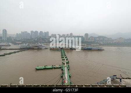 China, Chongqing, pier for Yangzte river cruise ships at night with ...