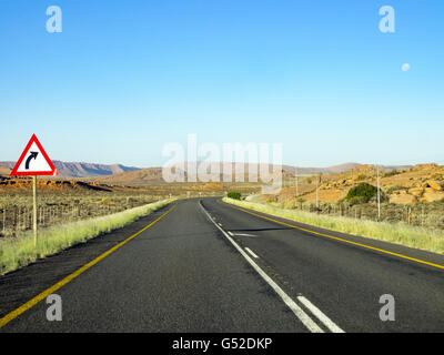 South Africa, North Cape, Kamieskroon, Lonely drive on a long road in ...