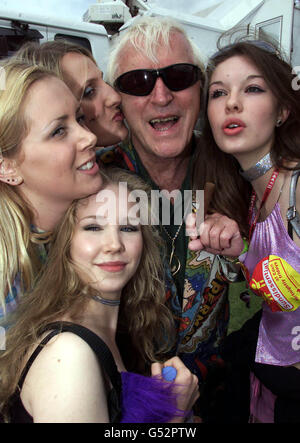 Sir Jimmy Savile with young revellers at the Radio One Love Parade in ...