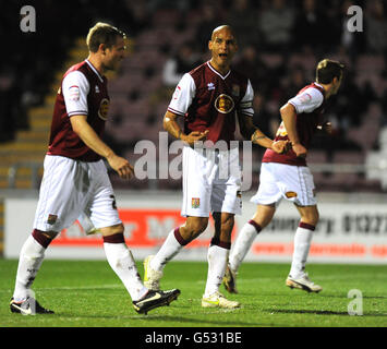 L-R: Northampton Town captain Clarke Carlisle, assistant referee Jake ...