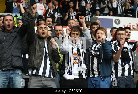 Newcastle United fans celebrate in the stands during the Premier League ...