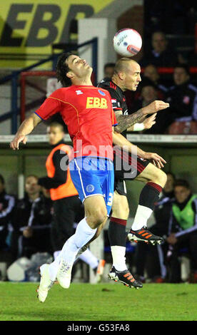 Swindon's Alan McCormack (left) is challenged by Aldershot's Adam Mekki ...