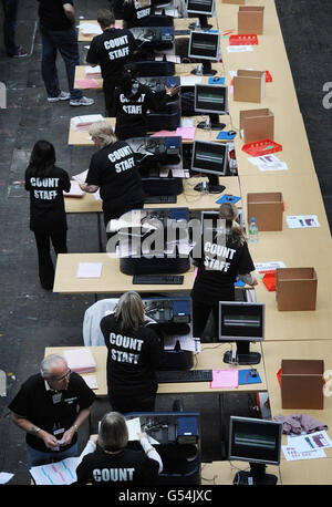 Counting staff at Olympia in London prepare to count the votes from ...