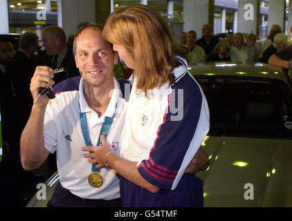 Olympic rower Steven Redgrave gets a kiss from his daughter Natalie ...
