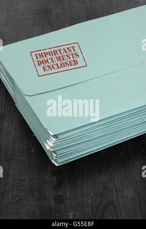 Folder with important documents enclosed stamped in red Stock Photo - Alamy