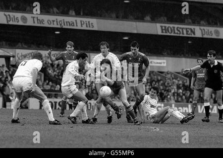 Liverpool's Ian Rush (c, on floor) fires the ball just wide, watched by ...