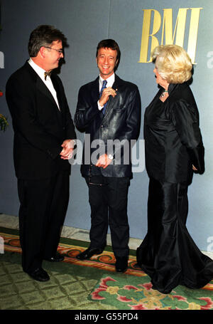 Bee Gees Singer Robin Gibb with his wife Molly Hullis (r) and two ...