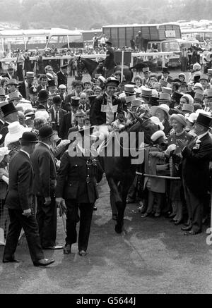 Mill Reef, ridden by G. Lewis, is led into the winners enclosure after ...