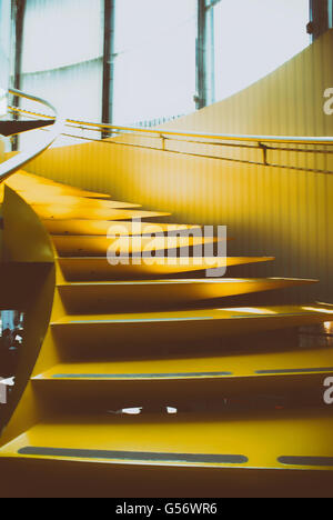 Photograph of a metal yellow abstract stairs Stock Photo - Alamy