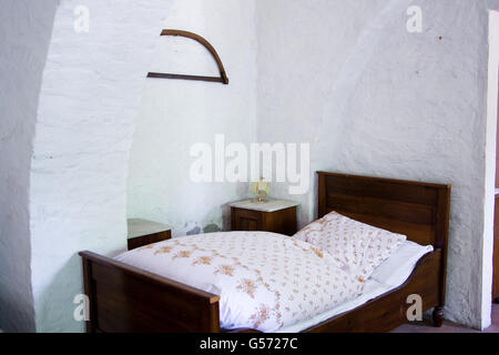 Empty old bed, messy vintage setting, slightly dirty Stock Photo - Alamy