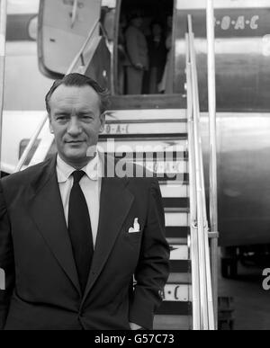 Actor George Sanders arrives for the Academy Awards presentation with ...