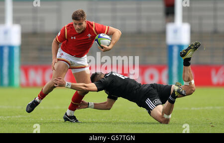 Wales' Joe Gage is tackled by New Zealand's Shaun Stevenson during the ...