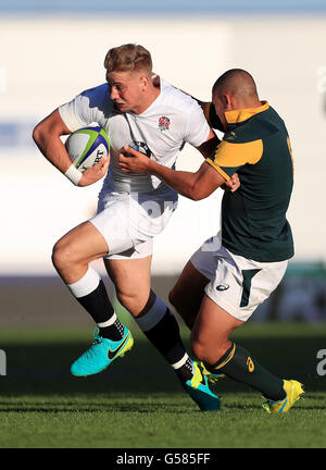 South Africa's Zain Davids is tackled by England's Lewis Boyce during ...