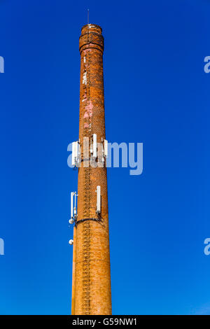 old brick chimney as cell towers Stock Photo - Alamy